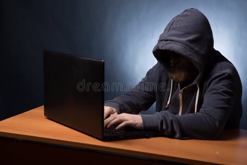 Hooded Computer Hacker Stealing Information with Laptop Stock Photo ...