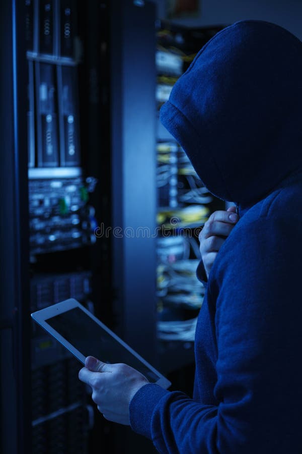 Hooded Computer Hacker Stealing Information with Tablet PC Stock Image ...