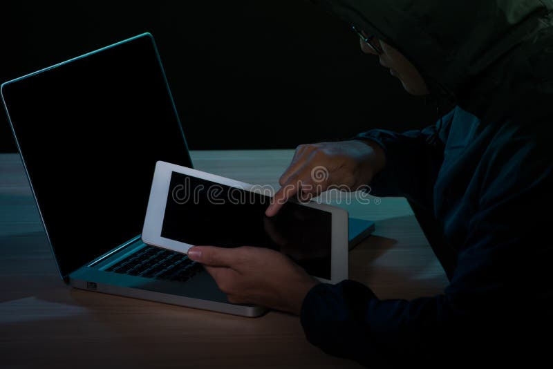Hooded Cyber Crime Hacker Using Digital Tablet Internet Hacking Stock ... Hooded Cyber Crime Hacker Using Digital Tablet Internet Hacking Stock ...