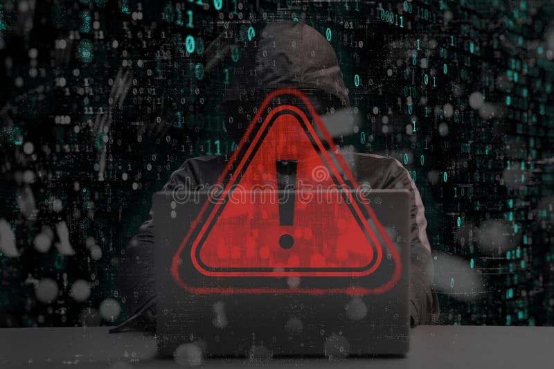A Hooded Hacker Behind a Laptop with a Red Glowing Warning with a ...
