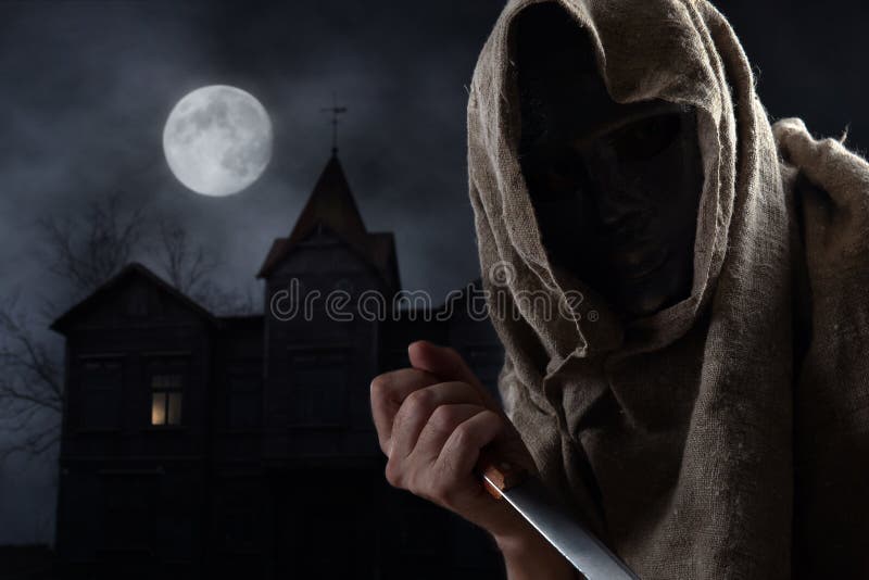 Hooded Man in Mask with Knife Stock Photo - Image of hide, face: 76471300