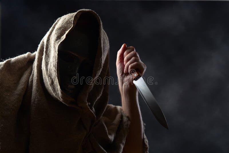 Hooded Man in Mask with a Knife Stock Photo - Image of murderer, dark ...