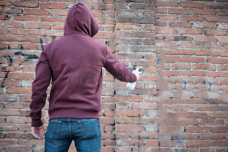 Hooded Tagger Writing Graffiti on Urban Walls Stock Photo - Image of ...