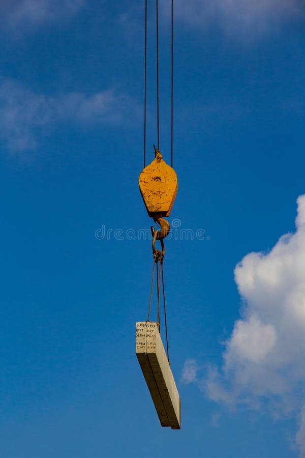 The Hook of a Construction Crane with a Suspended Load on the ...