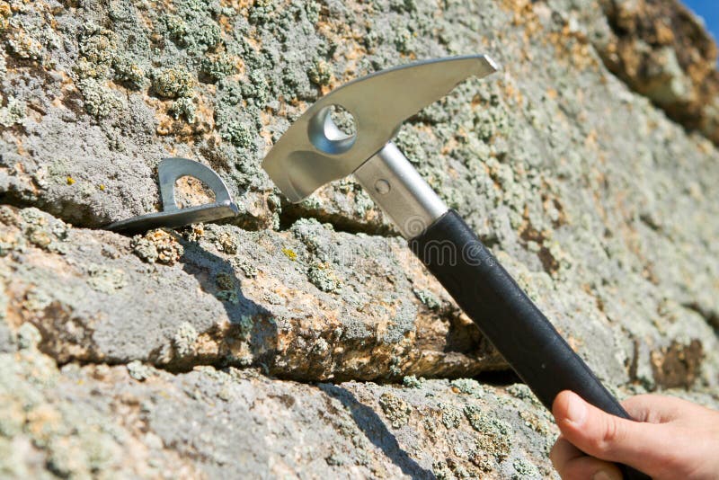 In Hook Hammer into Crack of Rock Hammer Stock Image - Image of hand ...