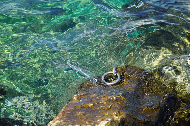 Hook on the Stone Immersing in the Transparent Sea Water Stock Photo ...