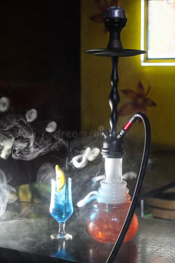 Hookah Bright with Smoke Beautiful is on the Table in the Club or Bar ...