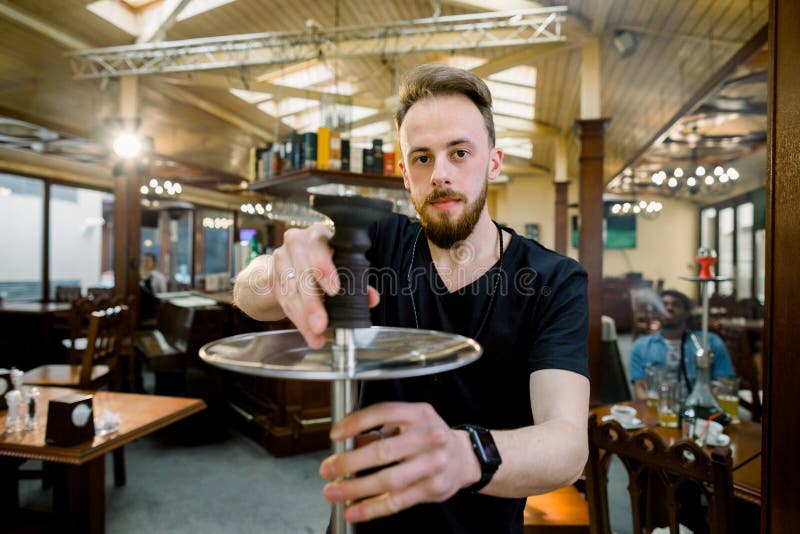 Hookah Server Waiter Prepares a Shisha Pipe for Smoking Stock Photo ...