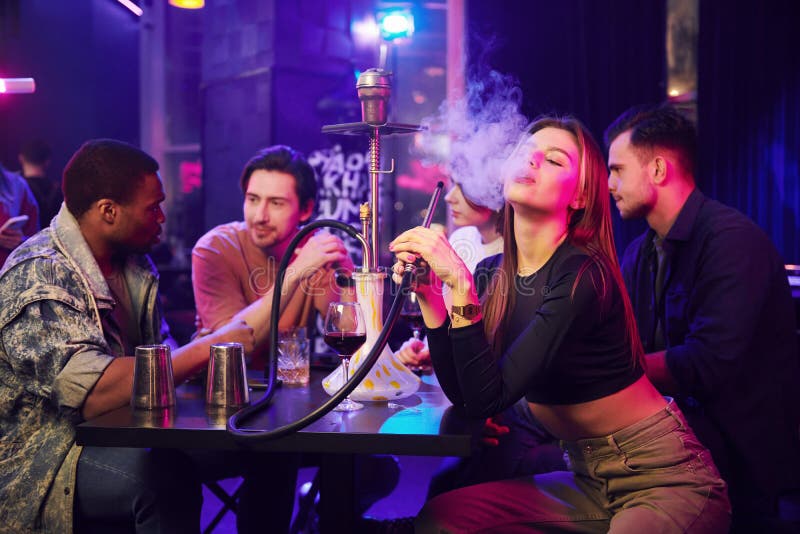 Hookah is on the Table. Group of Friends Having Fun in the Night Club ...