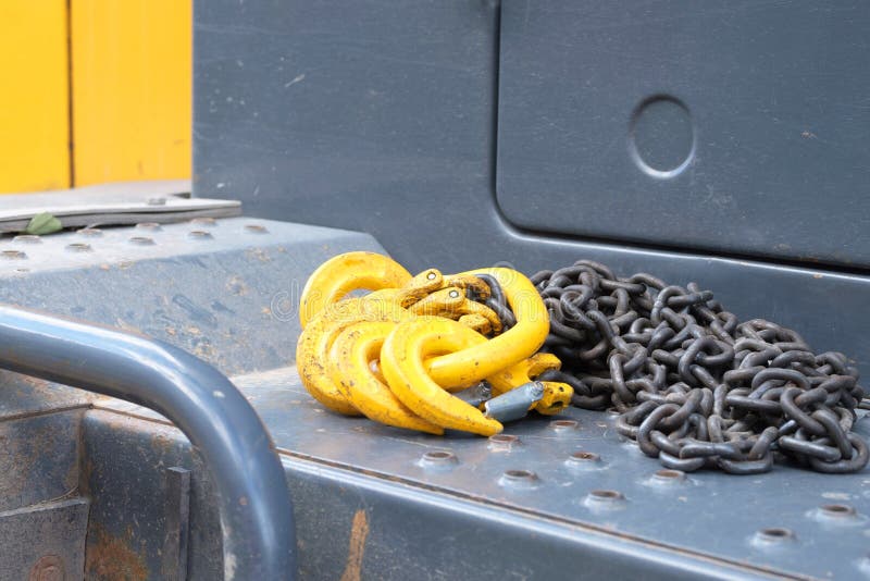 Hooks Made of Metal for Lifting Loads of Yellow Lie on the Truck Stock ...