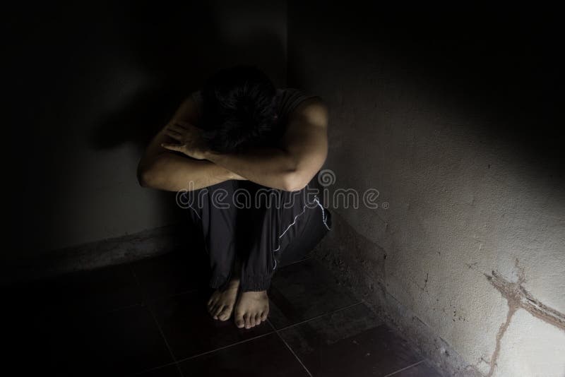 Hopeless Man Sitting in Dark Location. Stock Image - Image of ...