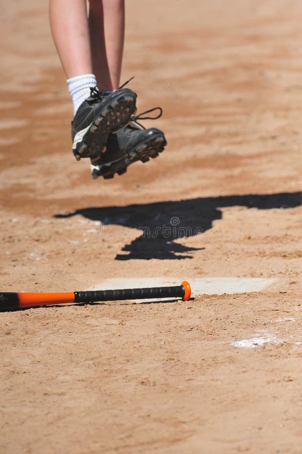 Hopping onto home plate stock photo. Image of plate, softball - 5618786
