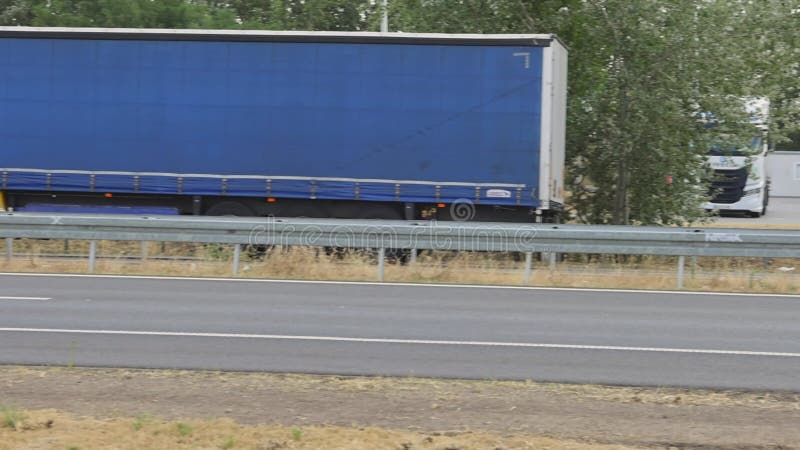 Lorry trucks queue pan stock video. Video of road, crossing - 320656091