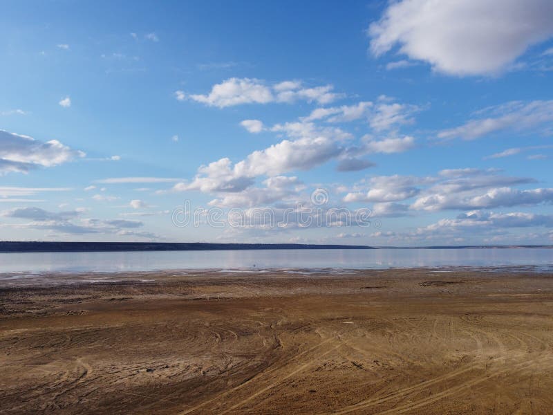 Horizon,where Fluffy White Clouds are Reflected in the Calm,deep Blue ...