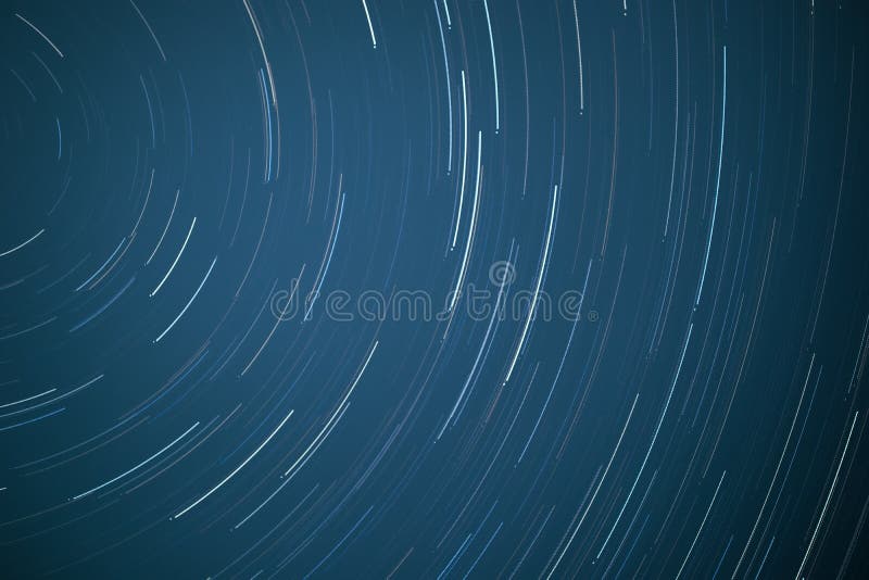 Horizontal Background of Star Trails on a Bright Blue Sky Stock Photo ...