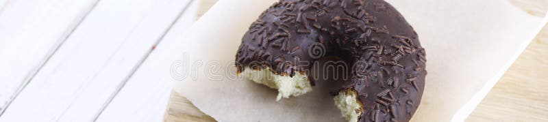 Horizontal Bakground of Chocolate Donuts on a Table Stock Photo - Image ...