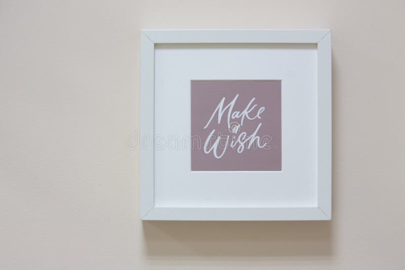 White Square Frame with Written `Make a Wish` Inside Stock Photo ...