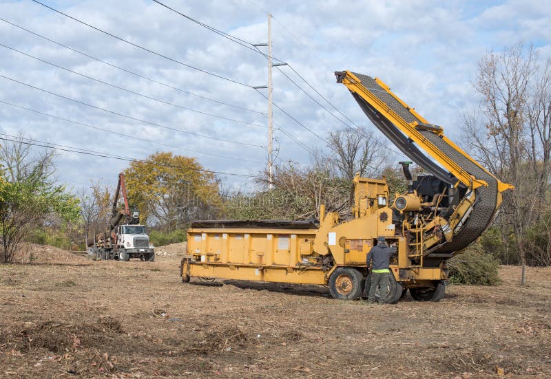 Horizontal Grinder with Log Truck during Deforestation Stock Image ...