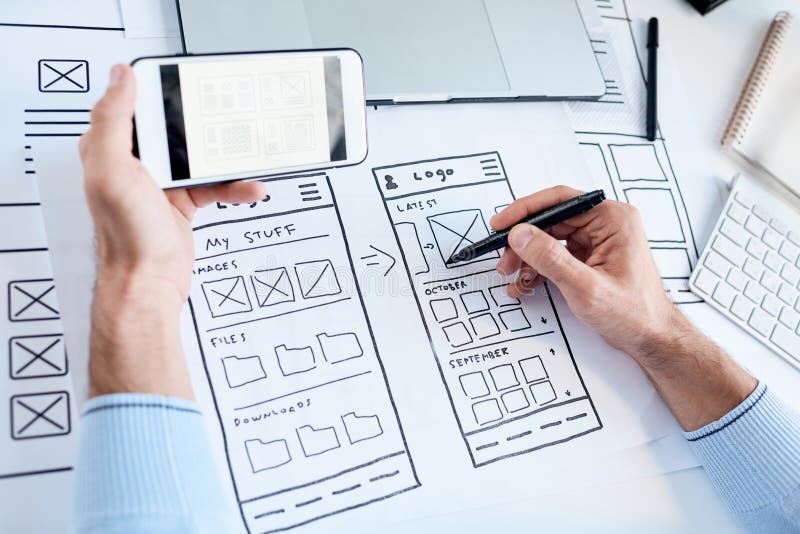 Mobile Software Developer Working Stock Photo - Image of paper ...