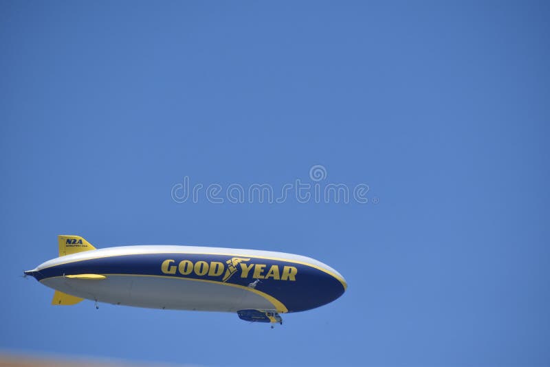 Red blimp in blue sky stock image. Image of aircraft, floating - 997237