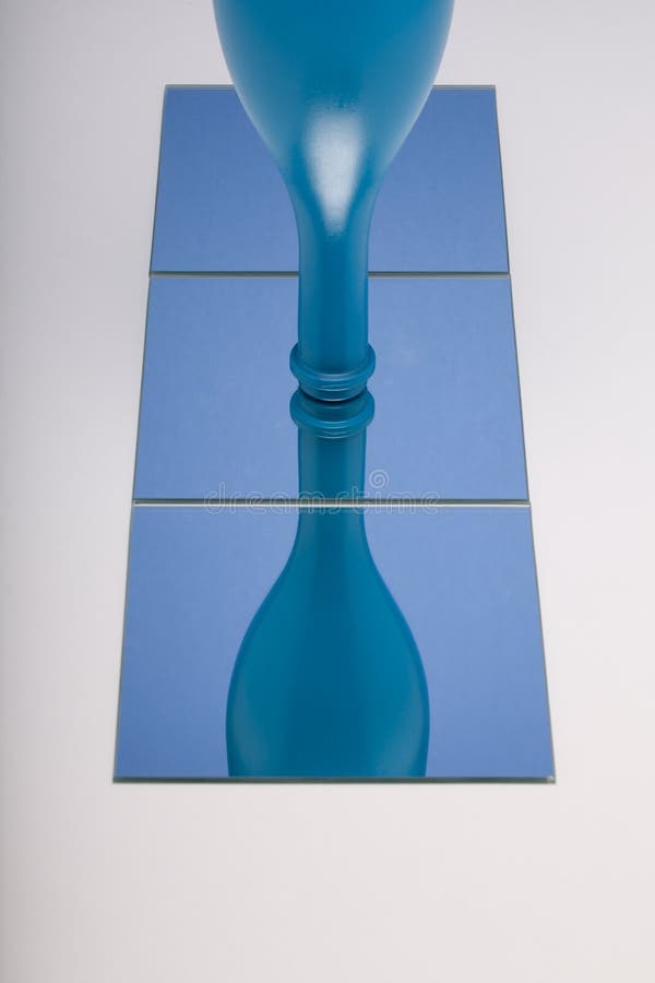 Horizontal Image of Mirror with Reflection Blue Bottle in Blue Mirror ...