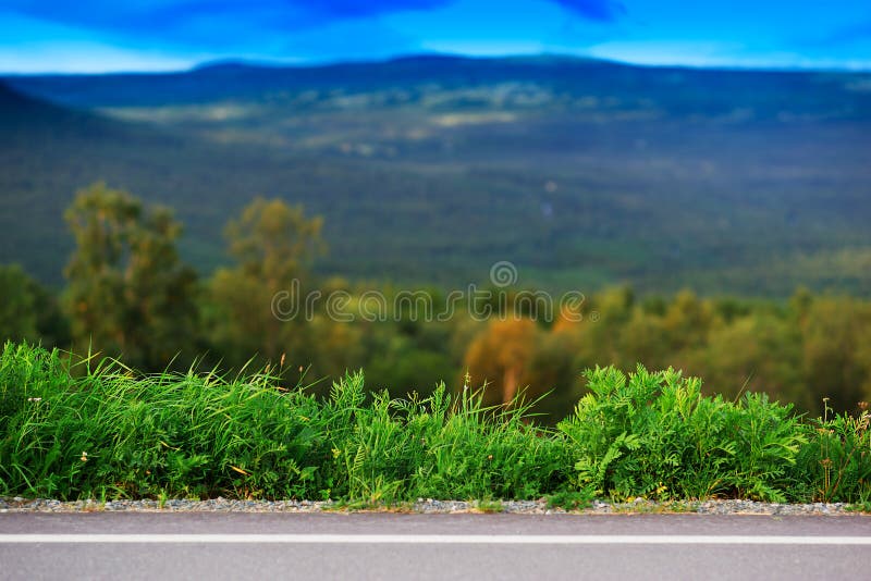 Horizontal Mountain Road with Grass Border Background Stock Image ...