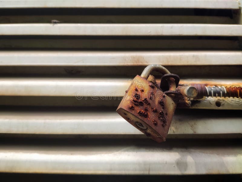 Horizontal Parallel White Louver Bars and Rusty Lock Stock Image ...