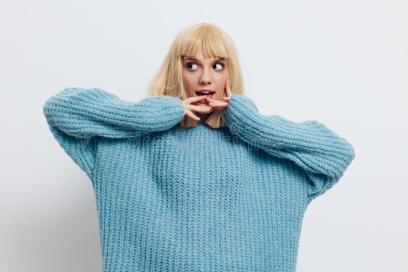 Horizontal Photo On A Light Background In A Light Blue Sweater Smiling