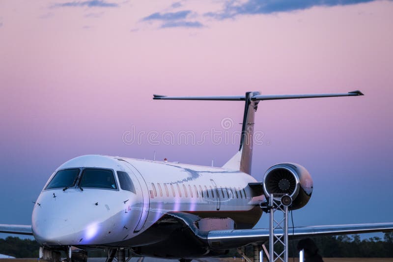 Small Jet Airplane on Runway at Sunset Stock Photo - Image of aircraft ...