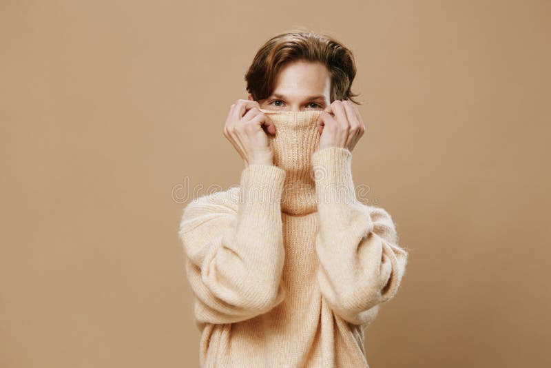 Young Man Pulling Sweater Over Head Stock Photos - Free & Royalty-Free ...