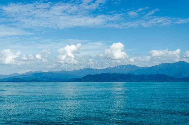 Horizontal of Seascape Including Forest Mountain, Blue Sky and Wave of ...