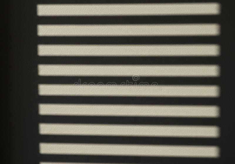 Horizontal Shadows of Evenly Spaced Lines Fall on a Textured, Beige ...
