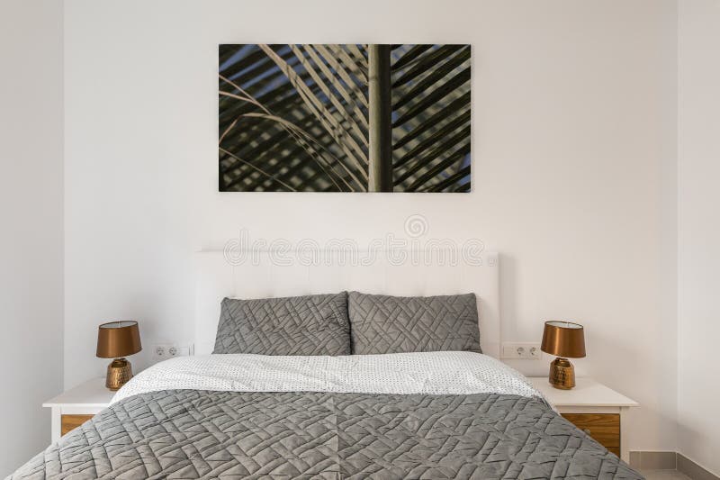 Horizontal Shot of a Bedroom with a Double Bed and Light Walls and ...