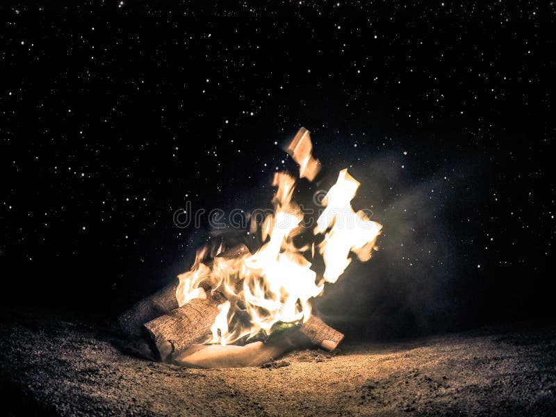 Horizontal Shot of a Bonfire at Night Time Under the Beautiful Starry ...