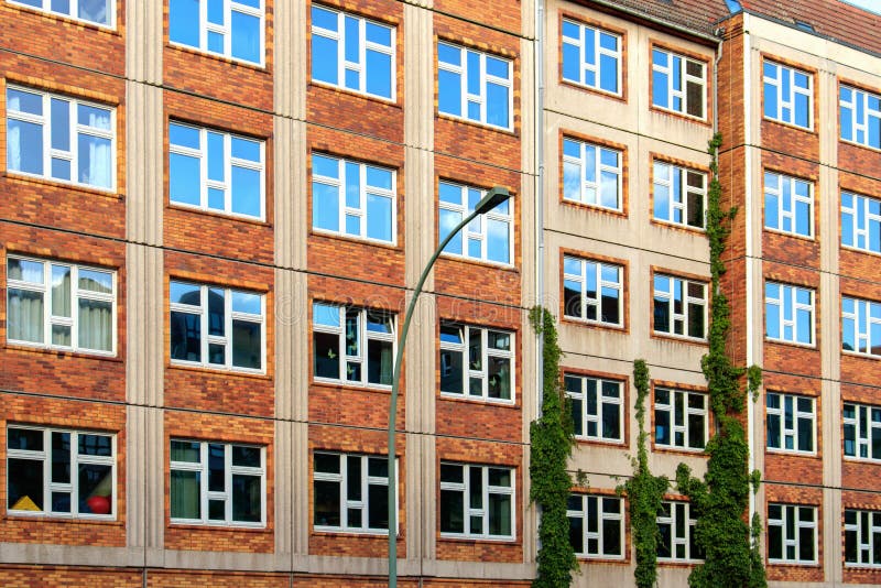 Horizontal Shot of a Brown Building with Green Plants Covering the ...