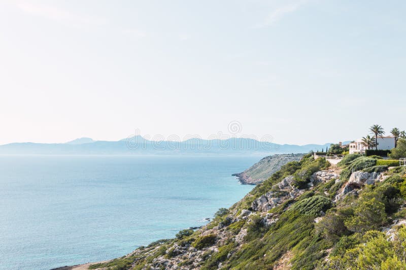 Horizontal Shot of a Cliff Next To a Beautiful Blue Sea during Daylight ...