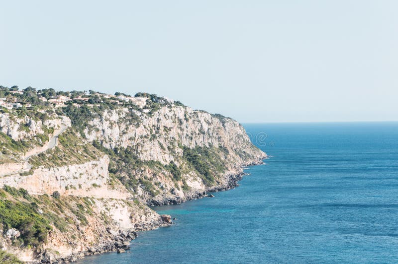 Horizontal Shot of a Cliff Next To a Beautiful Blue Sea during Daylight ...
