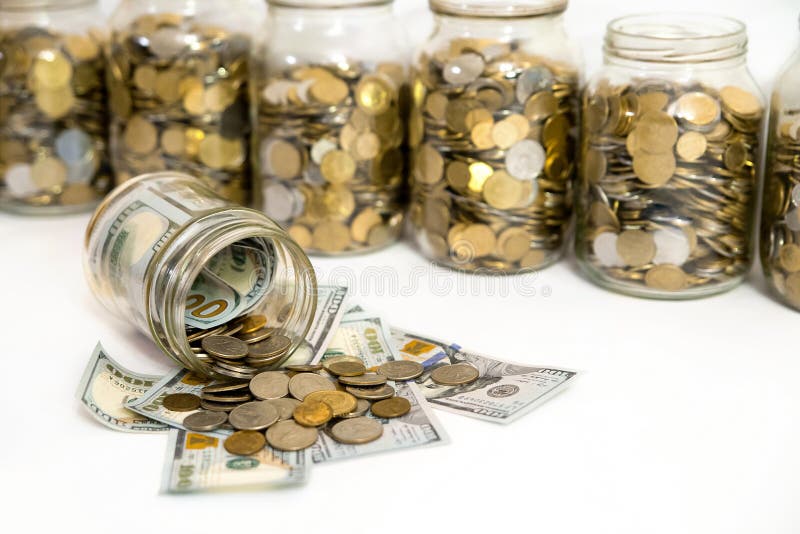 Horizontal Shot of Coins Spilling from Coin Jar Stock Photo - Image of ...