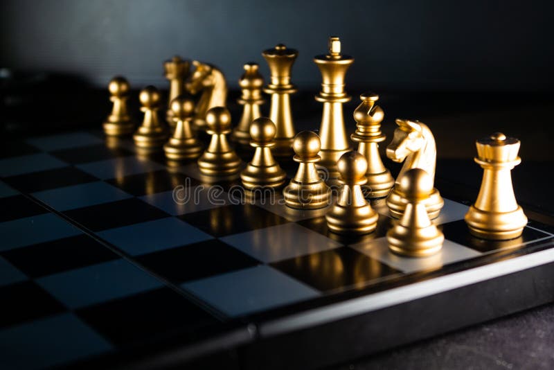 Horizontal Shot of Cool Gold Chess Pieces in the Starting Position ...