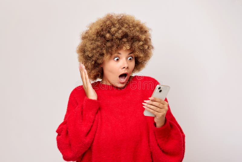 Horizontal Shot Of Emotional Astonished Woman With Curly Hair Uses