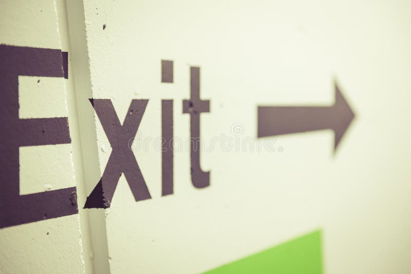 Horizontal Shot of an Exit Sign with an Arrow on the White Wall Stock ...