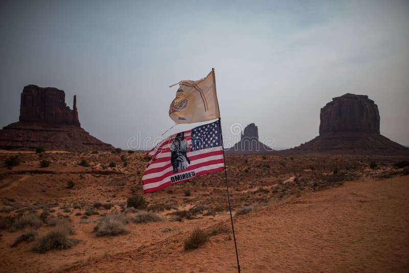 Horizontal Shot of Flag of US with a Geronimo Print in Front of Rock ...