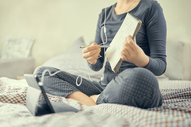 Studious Student Studying Online at Home. the Girl Shows Notes in a ...