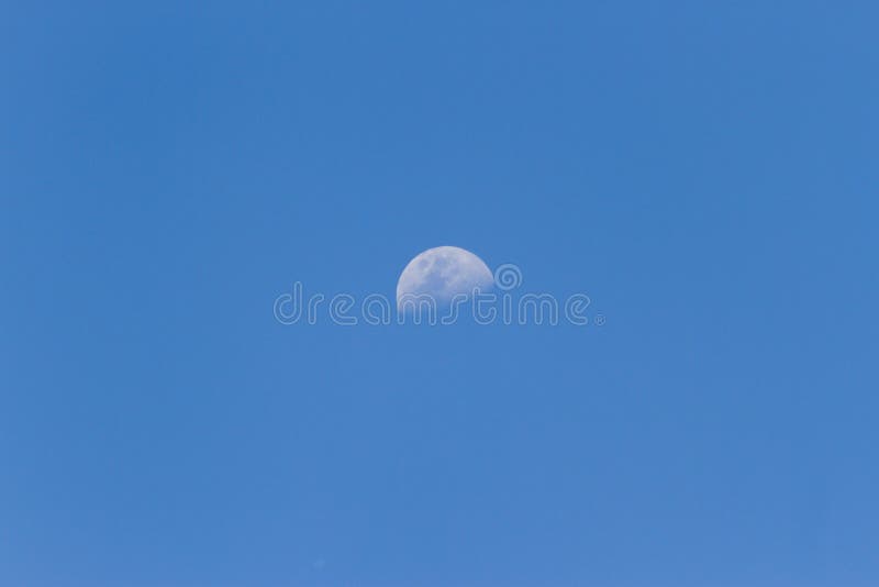 Horizontal Shot of a Half-moon Visible during Daylight in the Blue Sky ...