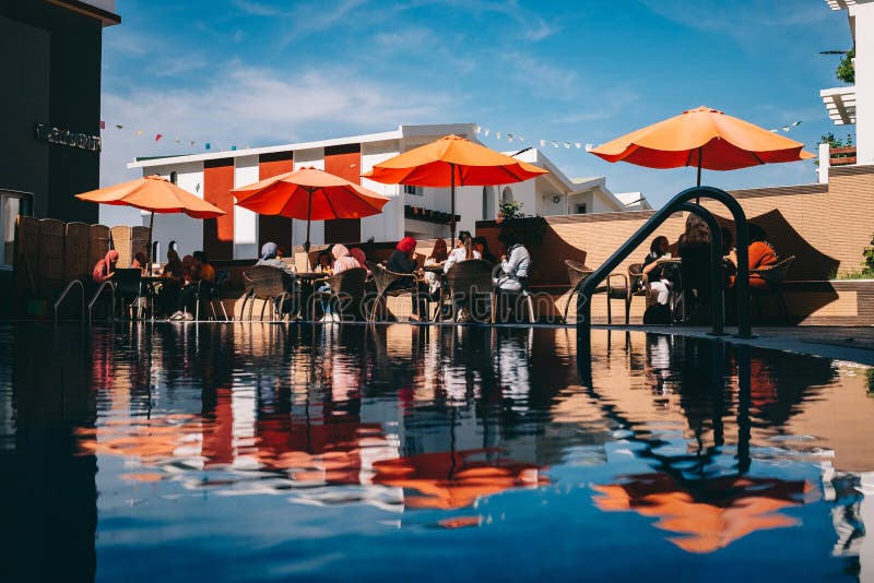 Horizontal Shot of People Sitting in a Pool Caffe in a Hotel. Editorial ...