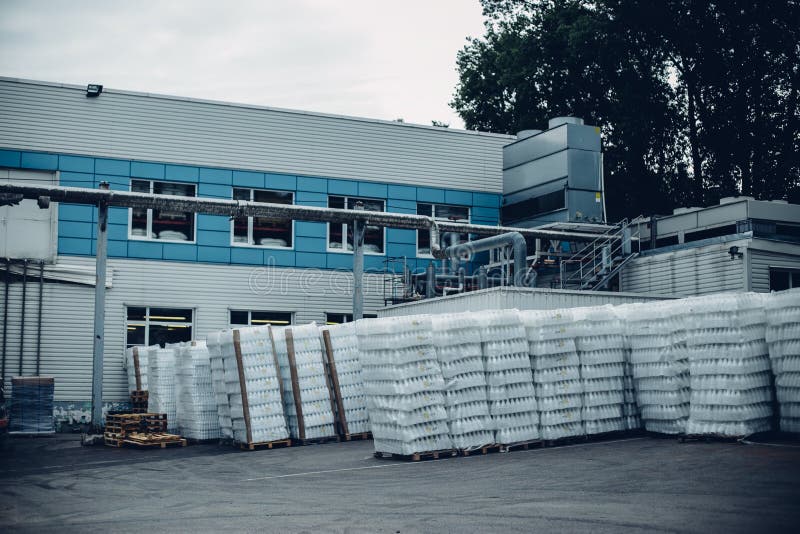 Horizontal Shot of Piles of Full Milk Bottle Packages in Front of the ...