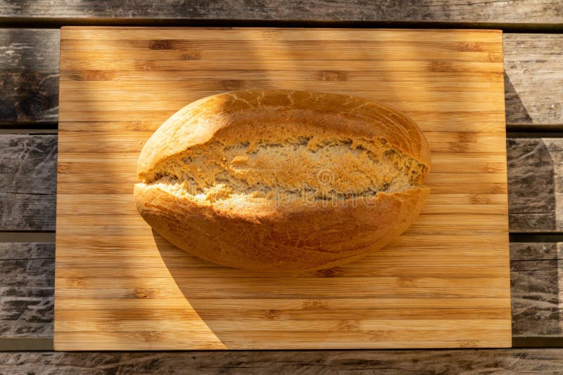 Horizontal Shot of Sourdough Bread on a Light Wood Cutting Board on a ...