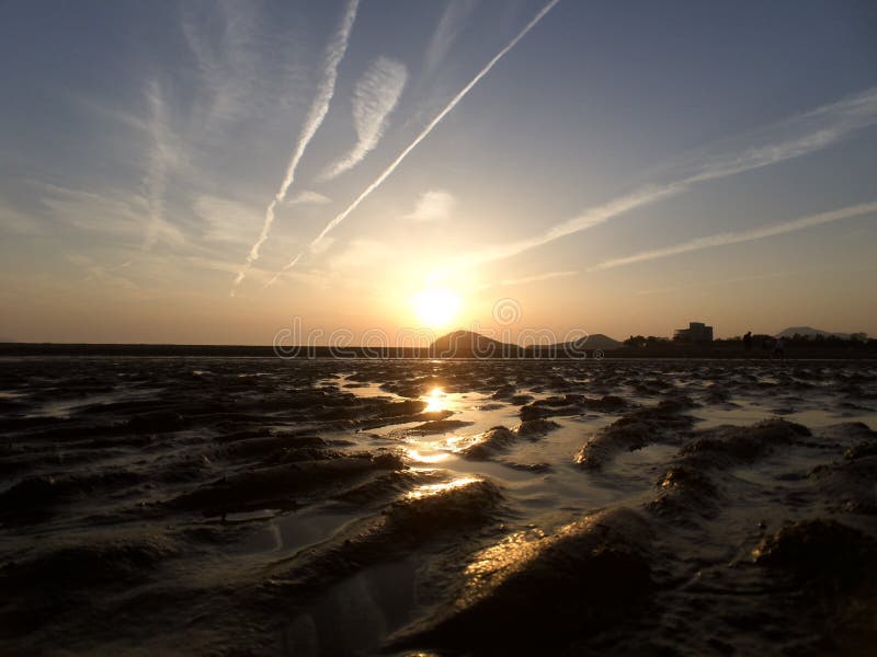 Horizontal Shot of the Sunrise Reflected in the Water Under the ...
