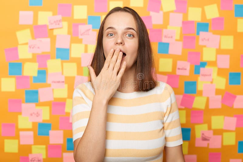 Horizontal Shot Of Surprised Caucasian Woman Wearing Striped T Shirt