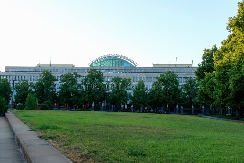 Horizontal Shot of Wide Building with a Green Park on the Front Stock ...